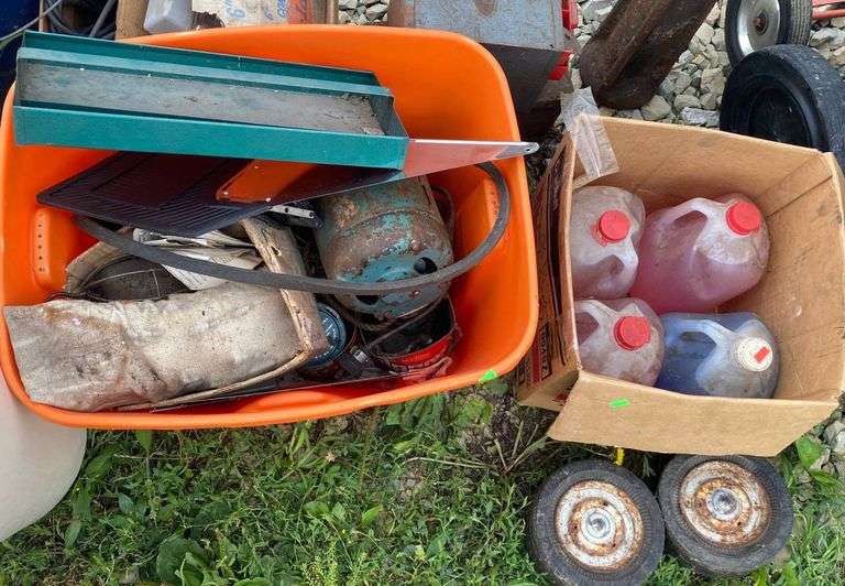 Containers with Unknown Liquid, Rusted Wheels, and Mechanical Parts ...