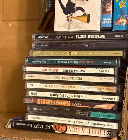 CDs and DVDs Featuring Various Music Genres and Entertainment Titles ...