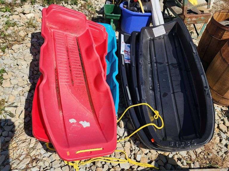 6 Plastic Sleds with Pull Ropes - Metzger Property Services, LLC