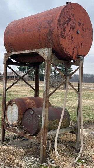 Overhead Fuel Tank with 2 Additional Drums, one says Standard Oil Co ...