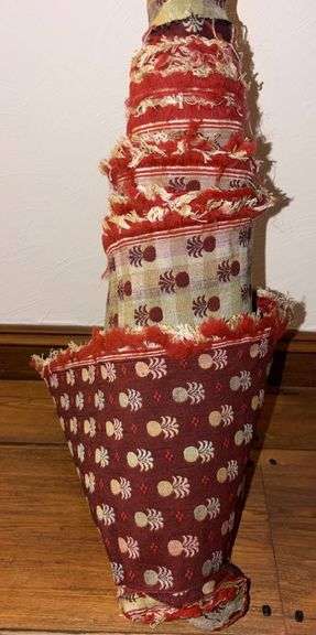 Roll of Fabric with Multicolored Pattern and Red Fringed Edges, pieces ...