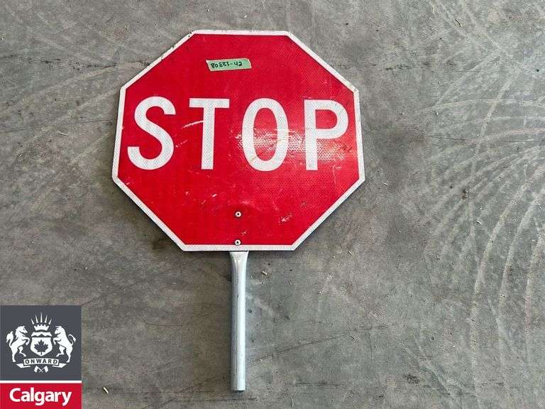 Stop slow sign - Michener Allen Auctioneering Ltd