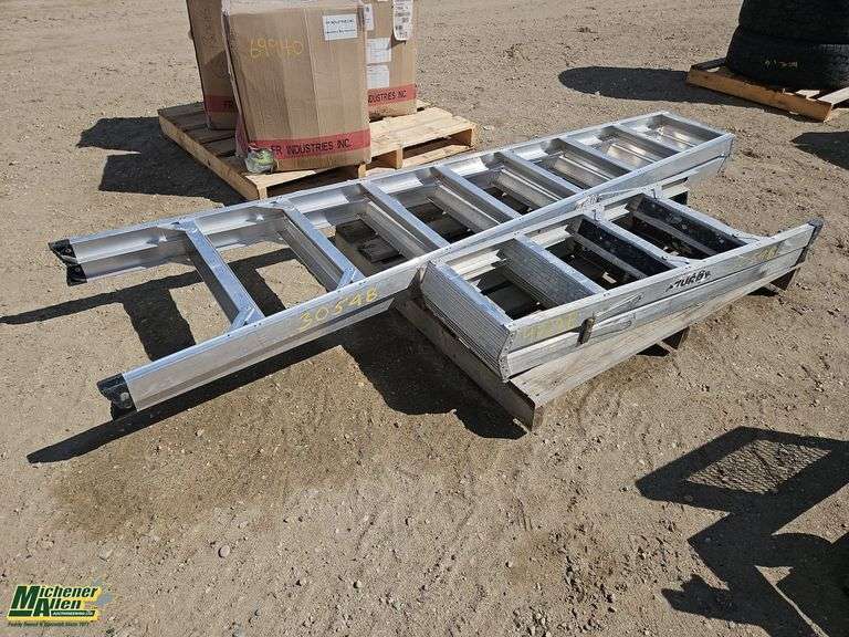 Pallet with 2 Ladders - Michener Allen Auctioneering Ltd