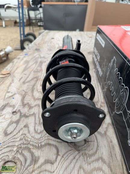 Strut Coil Spring Assembly - Michener Allen Auctioneering Ltd