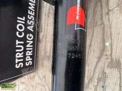 Strut Coil Spring Assembly - Michener Allen Auctioneering Ltd