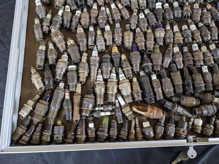 LARGE COLLECTION OF OLD SPARK PLUGS IN DISPLAY CASE - Millers Auction Co.