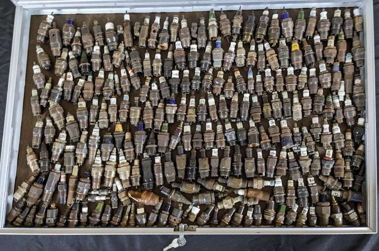 LARGE COLLECTION OF OLD SPARK PLUGS IN DISPLAY CASE - Millers Auction Co.