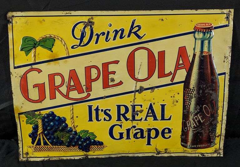 EMBOSSED TIN SIGN DRINK GRAPE OLA IT'S REAL GRAPE - Millers Auction Co.