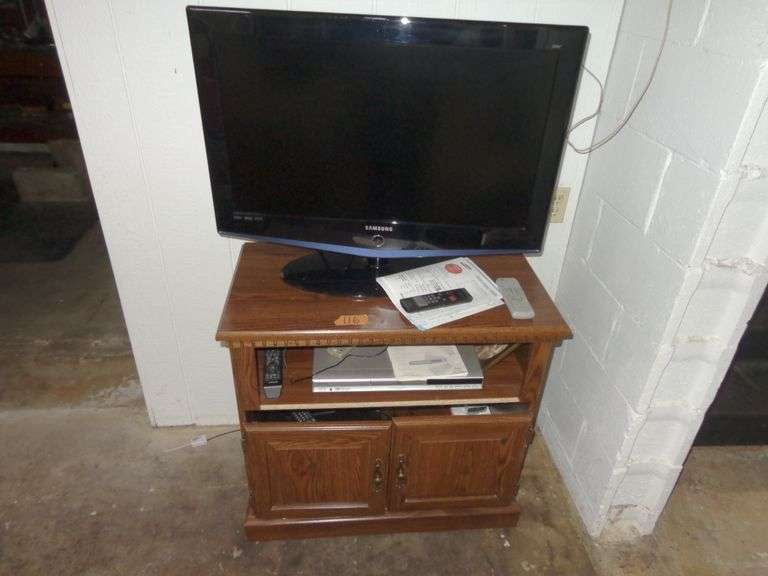 TV stand, Samsung TV with remote, VCR and DVD player. located in ...