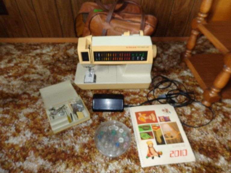 Singer Touch-Tronic 2010 memory sewing machine with case and book and ...