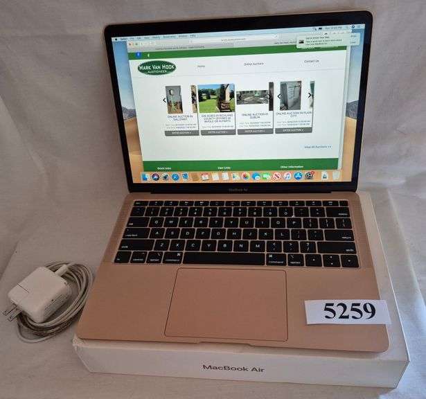 MacBook Air laptop computer with power supply - Mark Van Hook, Auctioneer