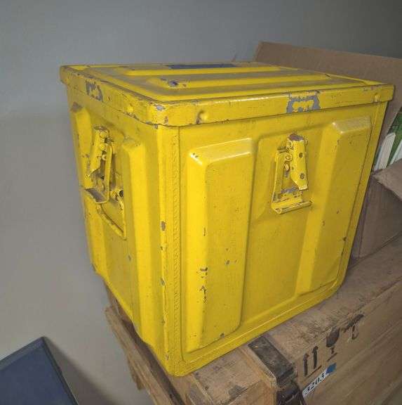Yellow metal crate, two bags of camouflage sandbags - Mark Van Hook ...