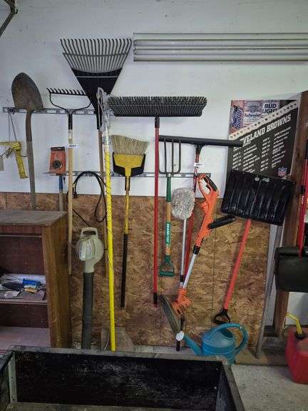 Yard tools, brooms, electric blower and weed trimmer, snow shovel, drop ...