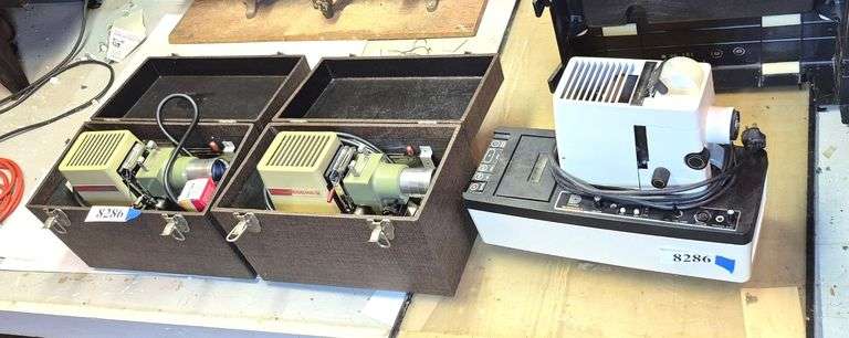 Three film strip projectors in cases - Mark Van Hook, Auctioneer