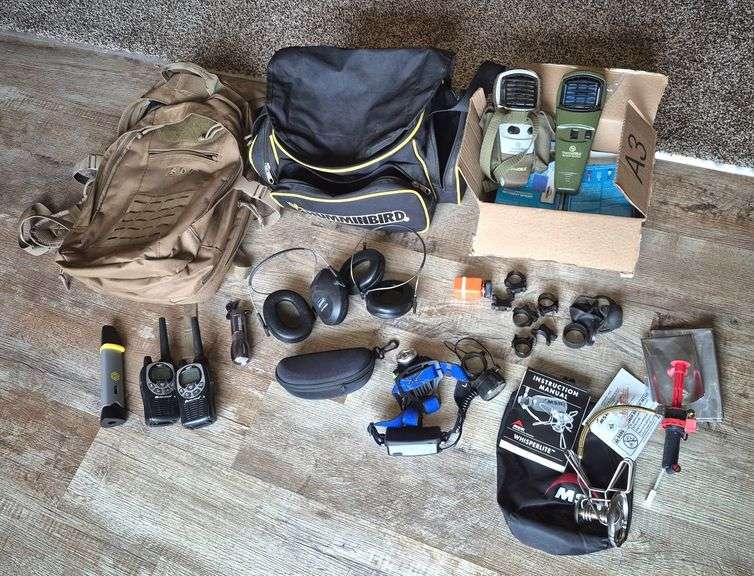 Pair of two-way radios, MSR Camp stove, hearing protection, headlamp ...