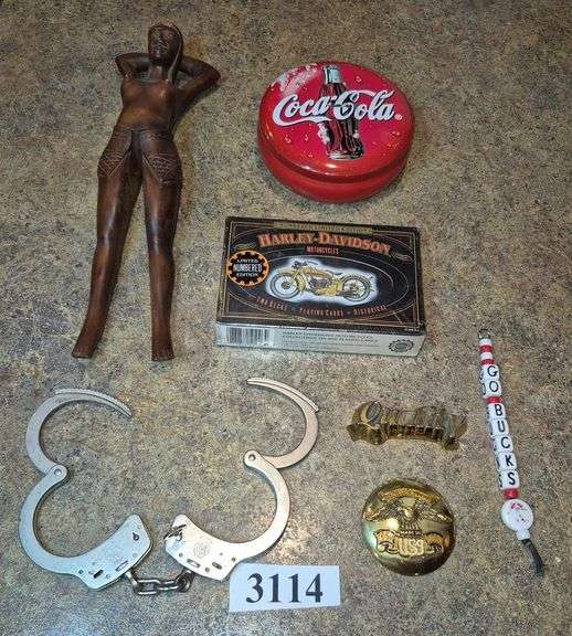Carved wood nutcracker, handcuffs with key, Harley-Davidson playing ...