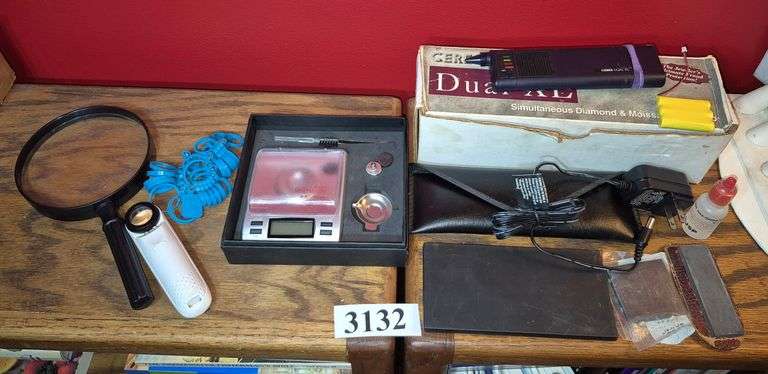 Diamond tester, scale, gold test stones and 18 karat liquid, ring sizer ...