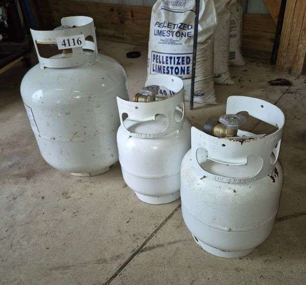 One regular and two small propane tanks - Mark Van Hook, Auctioneer