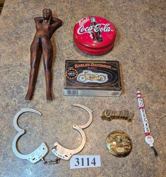 Carved wood nutcracker, handcuffs with key, Harley-Davidson playing ...