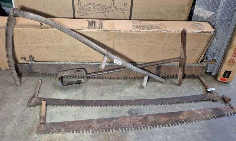 Two man saws, whole auger, scythe - Mark Van Hook, Auctioneer