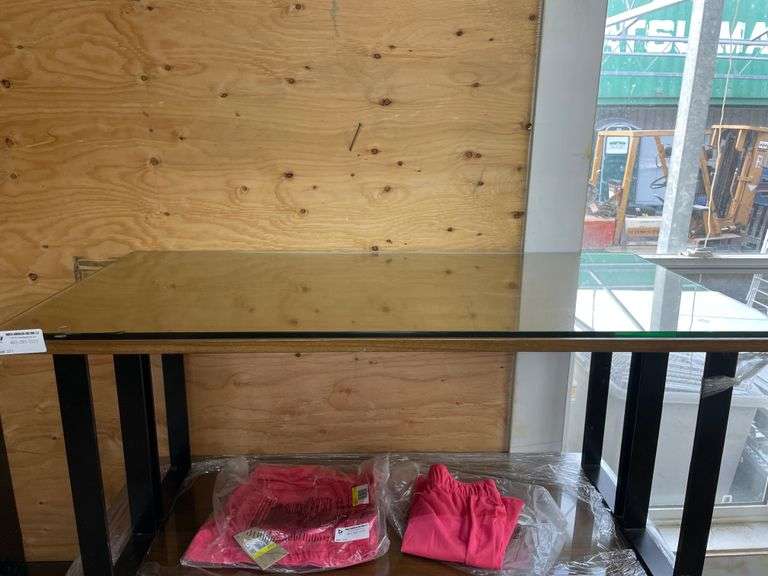 APPROX. 42IN GLASS TOP REC. COFFEE TABLE - North American Auction LLC