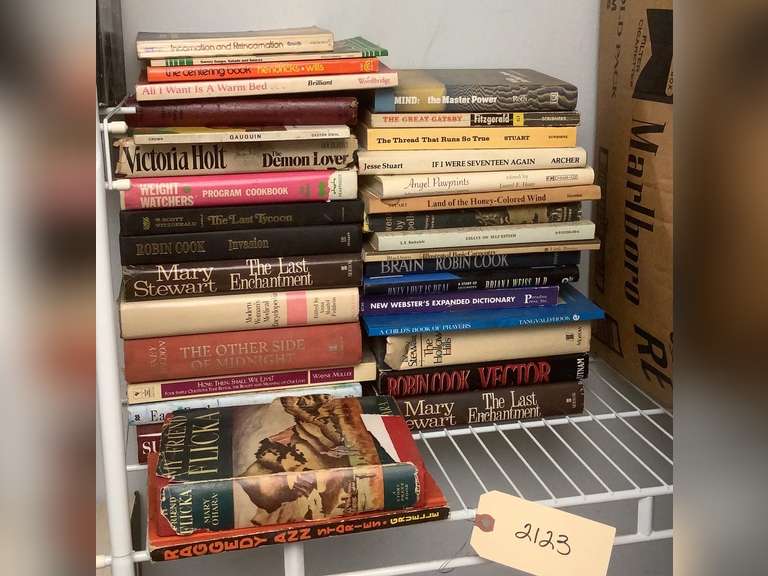 Shelf of books. - Northern Kentucky Auction, LLC