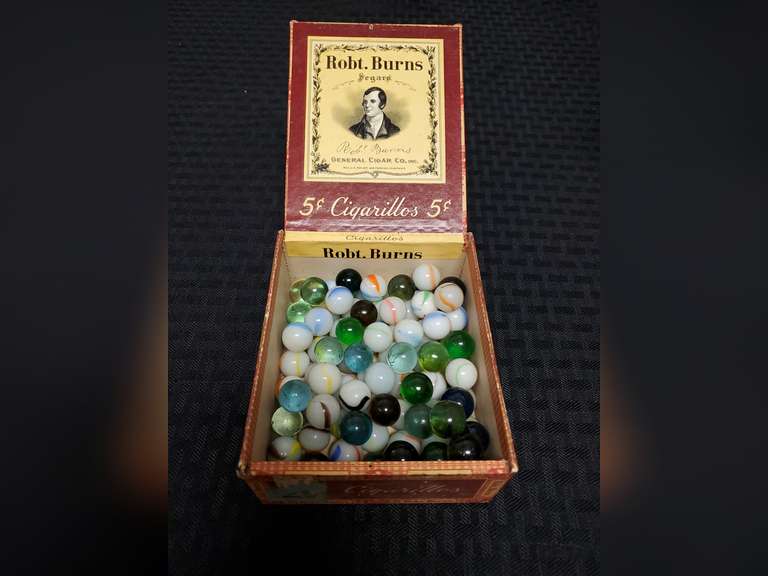 Rob Burns cigarillos box full of marbles - Northern Kentucky Auction, LLC