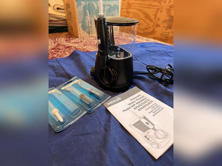 Waterpik water floss model WP – 660 and three additional pics. Came on ...