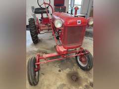 Farmall Cub. We did not try to start it. No fuel in the tank but the ...