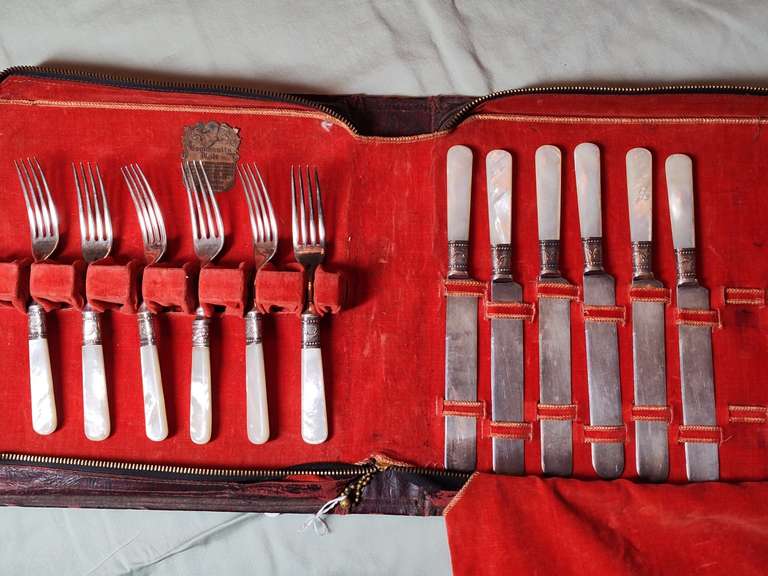 Old eating utensils forks and knives marked Sterling on the band ...