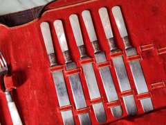 Old eating utensils forks and knives marked Sterling on the band ...
