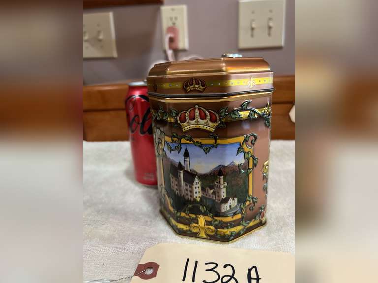 Musical cookie tin with colored stones. Music works. Tin is 5.5” tall ...