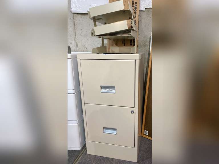 Two drawer heavy filing cabinet, 29” x 18 1/2” and hanging folders ...