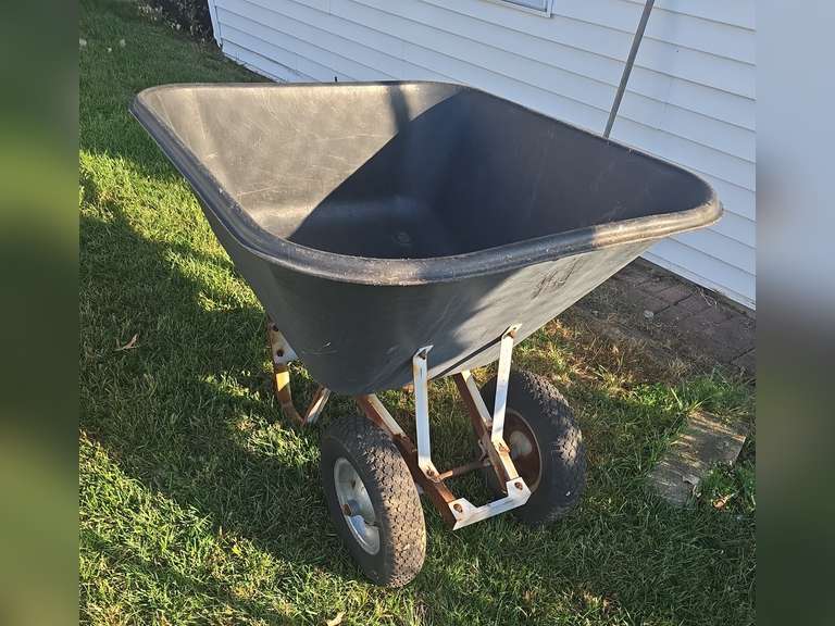 Wheelbarrow and garden hoe - Northern Kentucky Auction, LLC