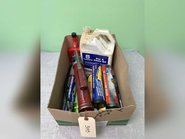 Bar and chain oil, STP, grease gun and tubes of grease. - Northern ...