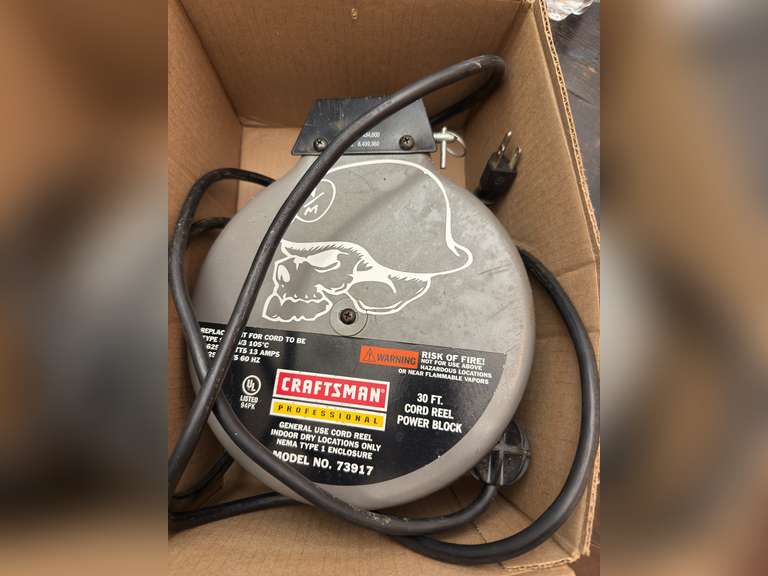 Hanging retractable 30 ft power cord - Northern Kentucky Auction, LLC