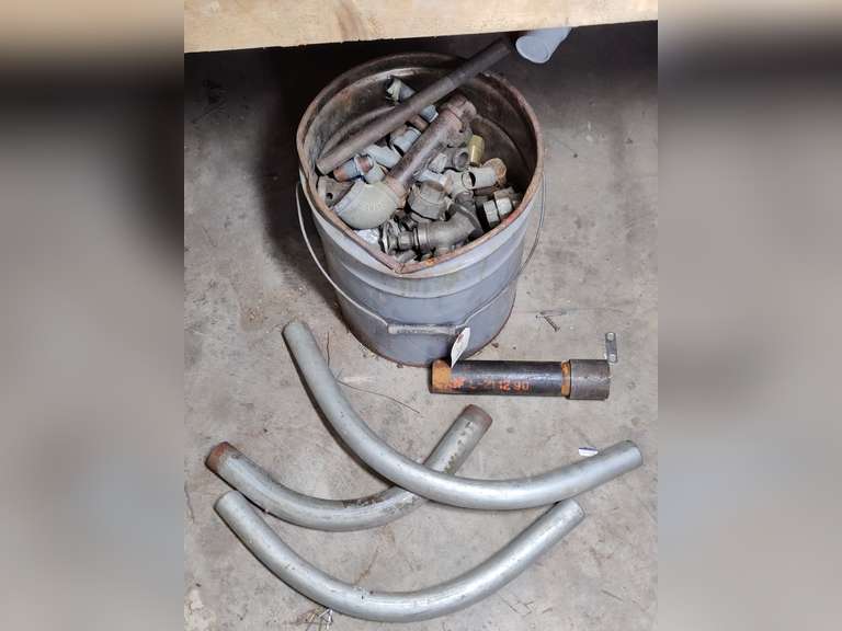Metal bucket filled with galvanized pipe fittings and more - Northern ...