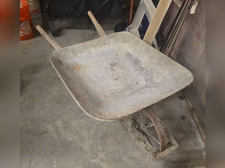 Antique iron wheel wheelbarrow - Northern Kentucky Auction, LLC