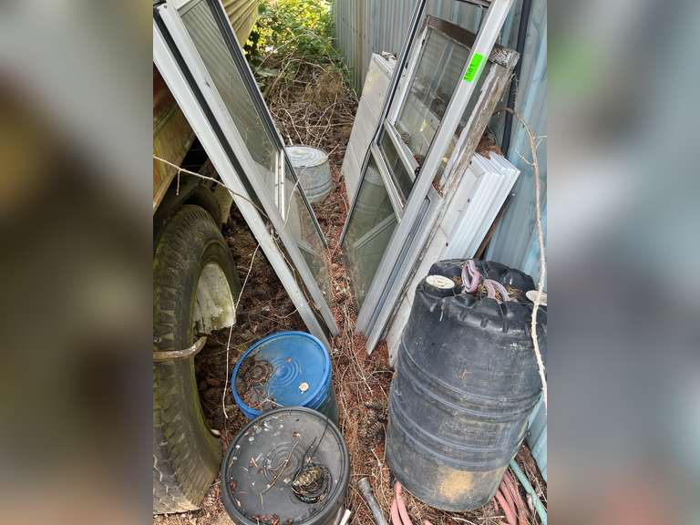 Aluminum windows; wash tub; 2) buckets; One empty plastic chemical ...
