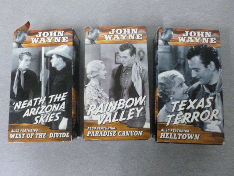 Group Of (3) Sets Of 2 John Wayne VHS Sets - Oberman Auctions