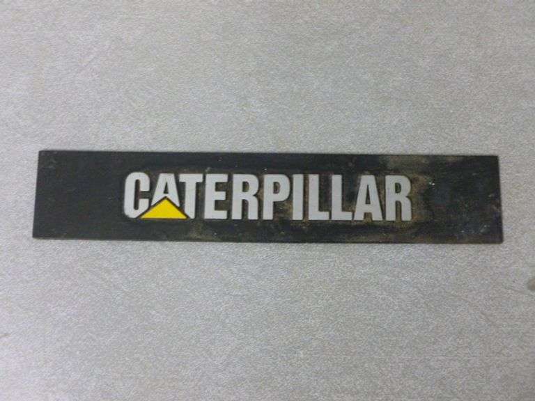 Caterpillar Cast Metal Emblem - 9" L - Oberman Auctions