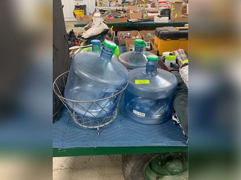 4 Primo water jugs and wire crate - Parrott Marketing Group