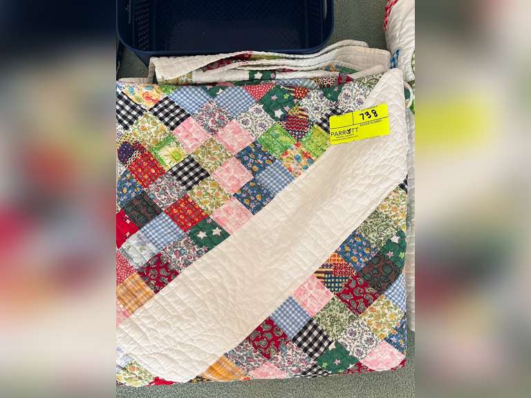 Floral design hand stitched quilt - Parrott Marketing Group