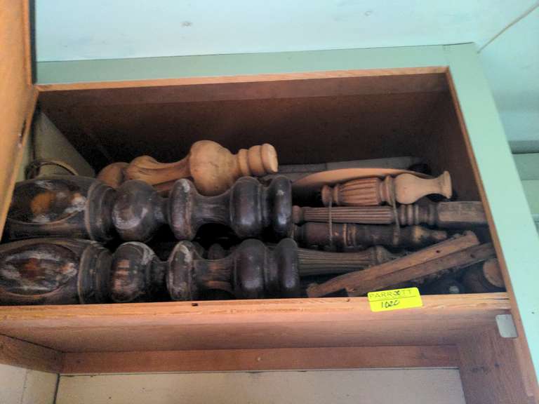 Group of wooden items including table legs chair spindles and trim ...