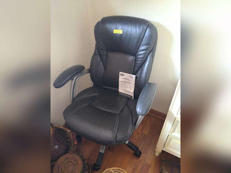 Vinyl roll around office chair - Parrott Marketing Group, LLC