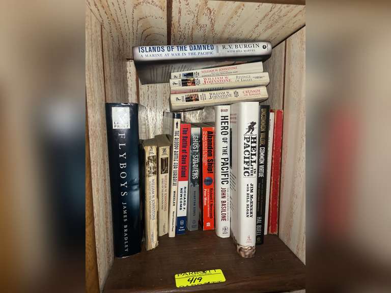 Shelf of military story books - Parrott Marketing Group