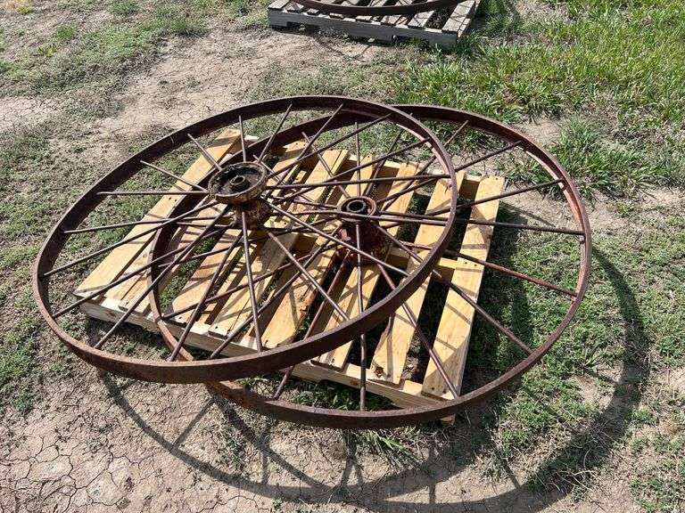 (2) 54” Steel Dump Rake Wheels. - Peterson Land & Auction LLC