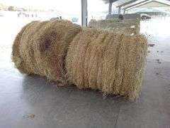 2 Round Bales 1st Grass (4x4) Stored Inside - Rogers Community Auction Inc.