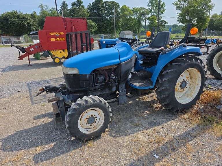 New Holland 1630 Tractor - Rogers Community Auction Inc.