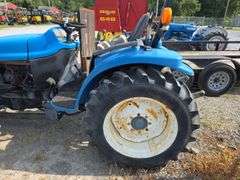 New Holland 1630 Tractor - Rogers Community Auction Inc.